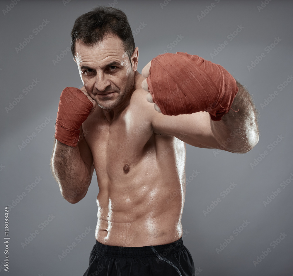 Kickbox fighter on gray background Stock Photo | Adobe Stock