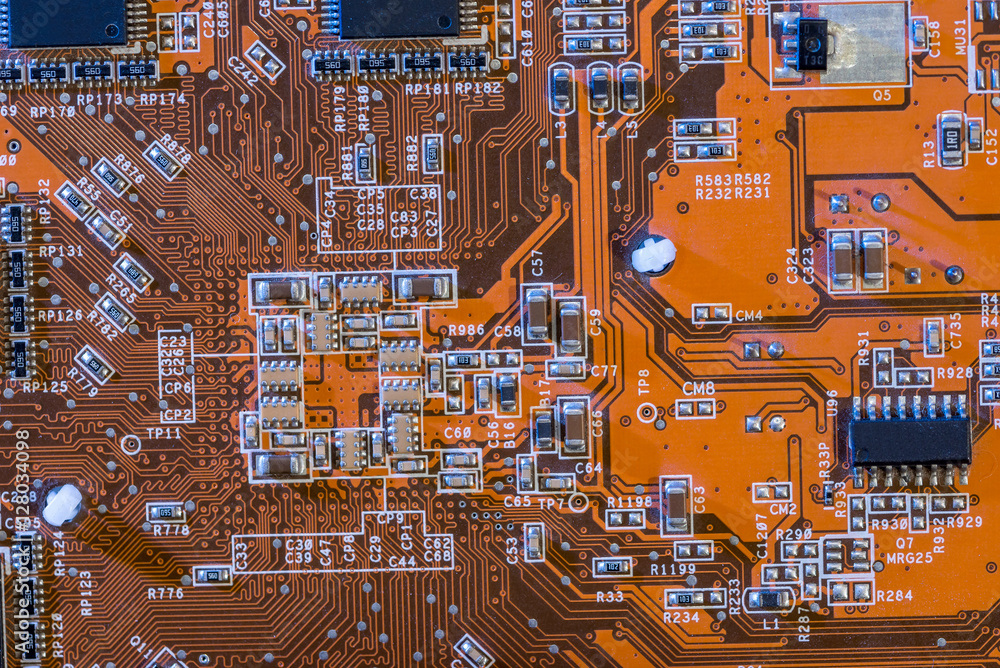 Macro shot of backside of orange computer circuit board Stock Photo ...