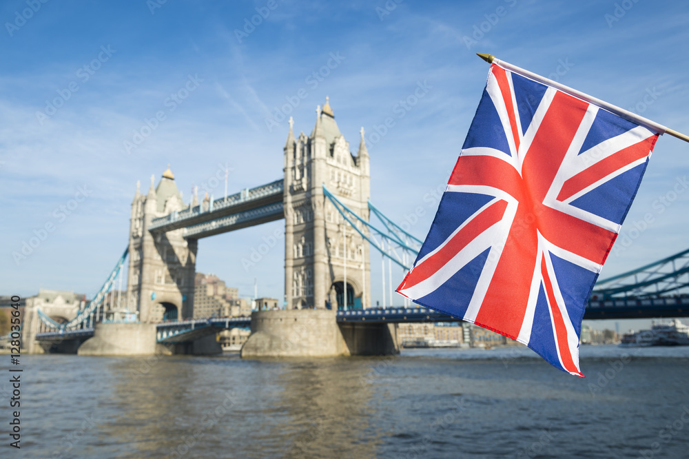British Union Jack flag flying in front of Tower Bridge in London ...