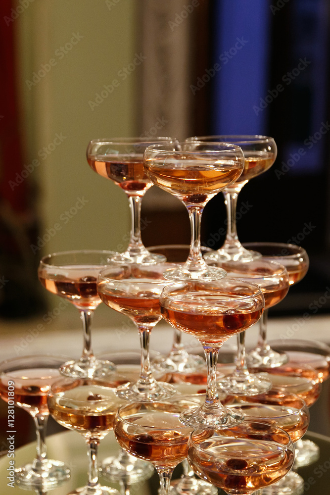 Stack of champagne glasses on table in wedding party Stock Photo ...