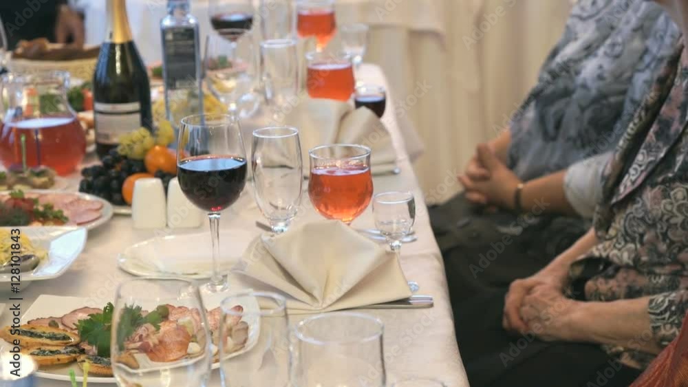 Waiter pouring glass of berry juice from pitcher Stock Video | Adobe Stock