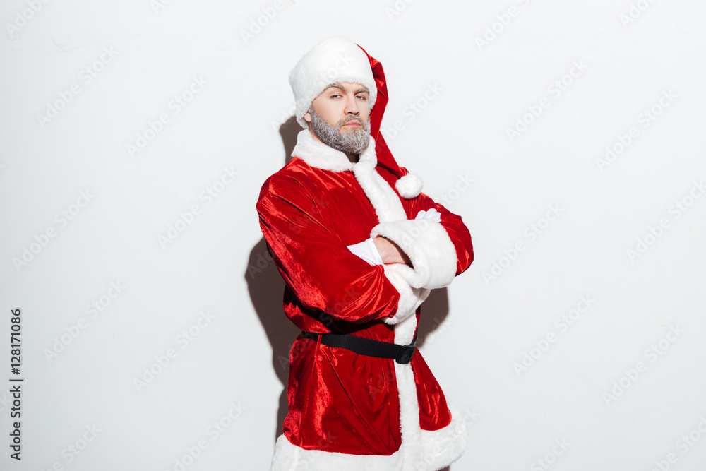 Handsome santa claus standing with arms crossed Stock Photo | Adobe Stock