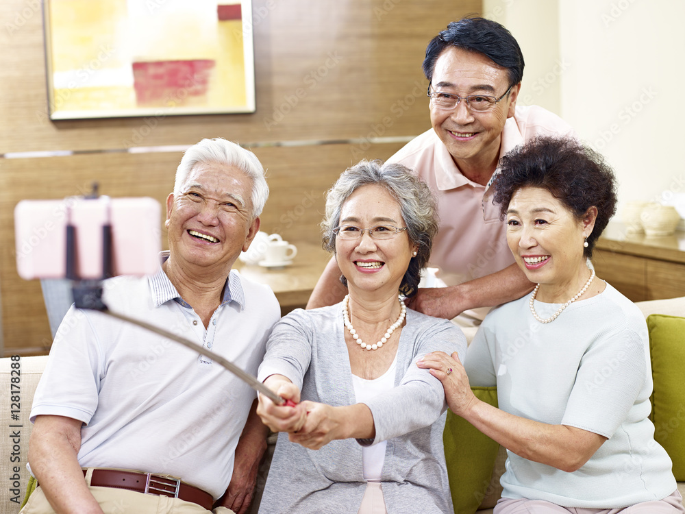 two senior asian couples taking a selfie at home Stock Photo | Adobe Stock