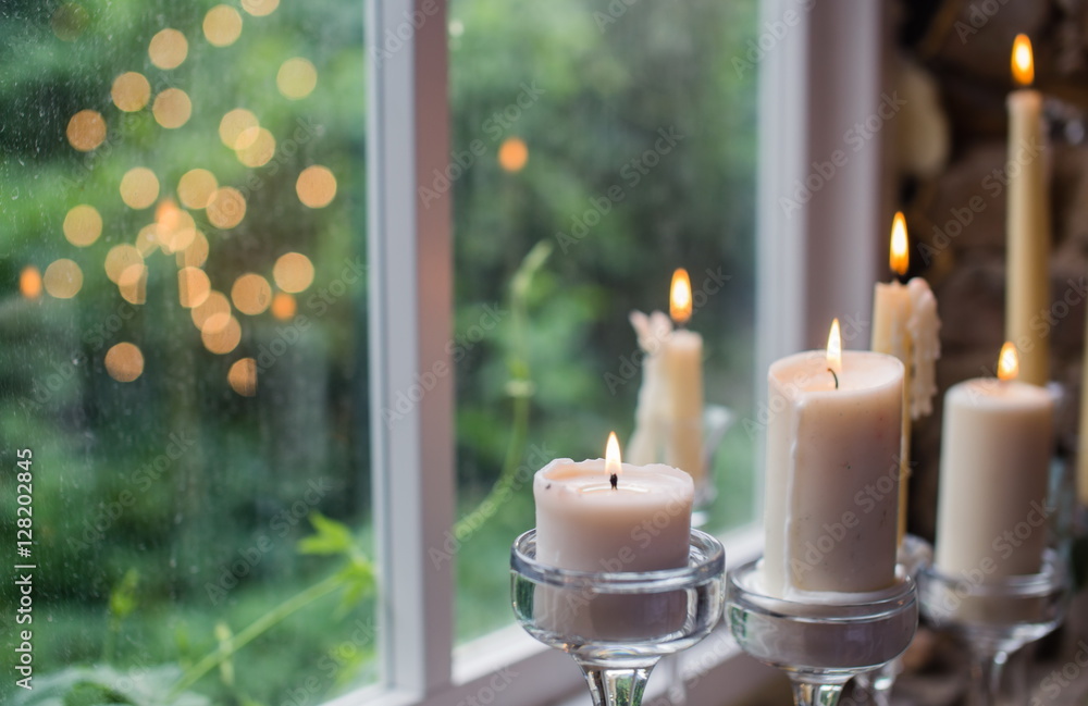 White candles in glass holders. Beautiful rustic wedding decoration ...