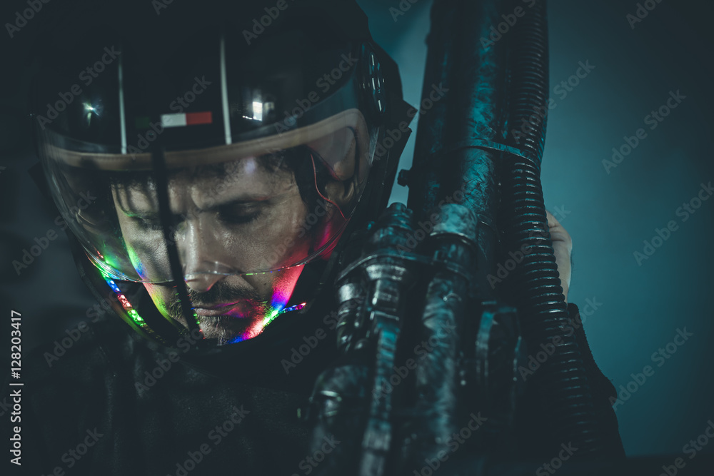 Space man with metal helmet and laser beam weapon Stock Photo | Adobe Stock