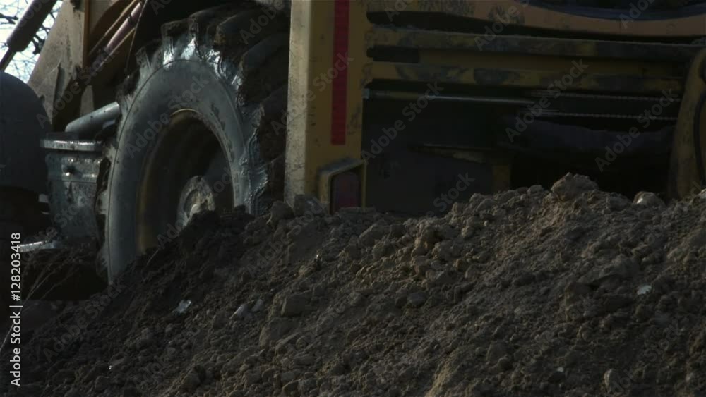Construction excavator digging hole. Close up. Excavator dripping ...