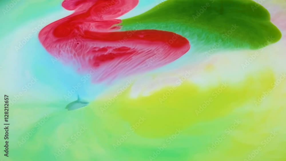 Beautiful movement of bright colors on a white background. Red, blue ...