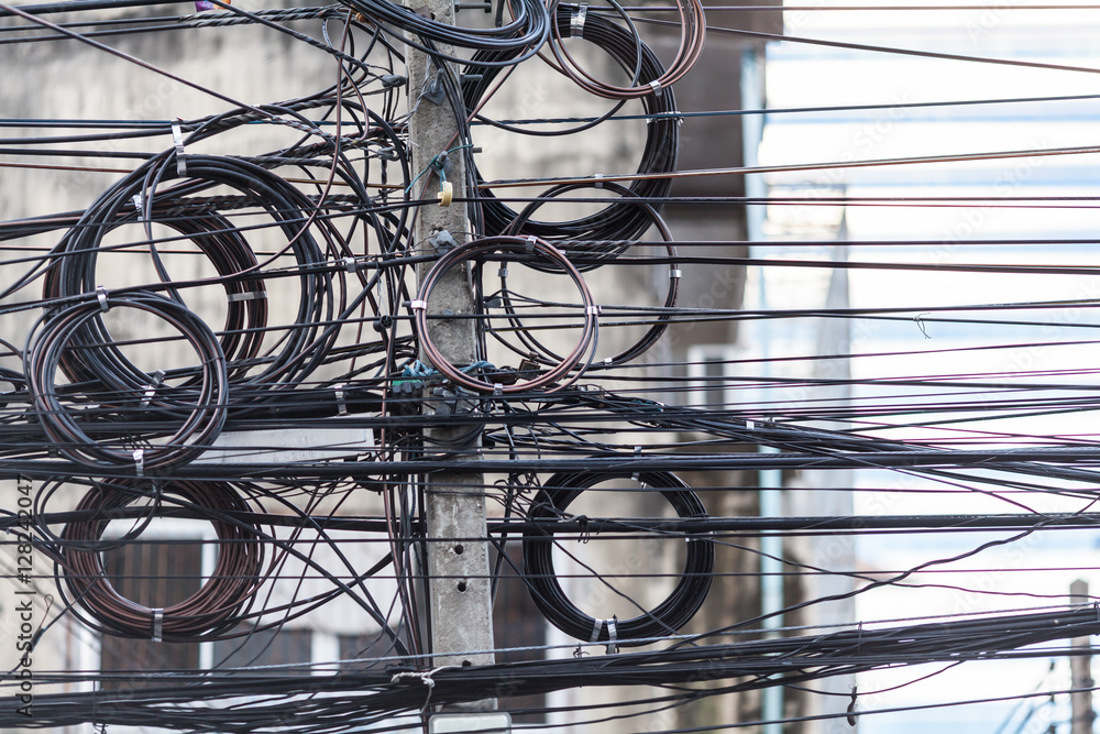 Electrical network and internet wire.Tangled wiring electrical in Bangkok city. Stock Photo ...