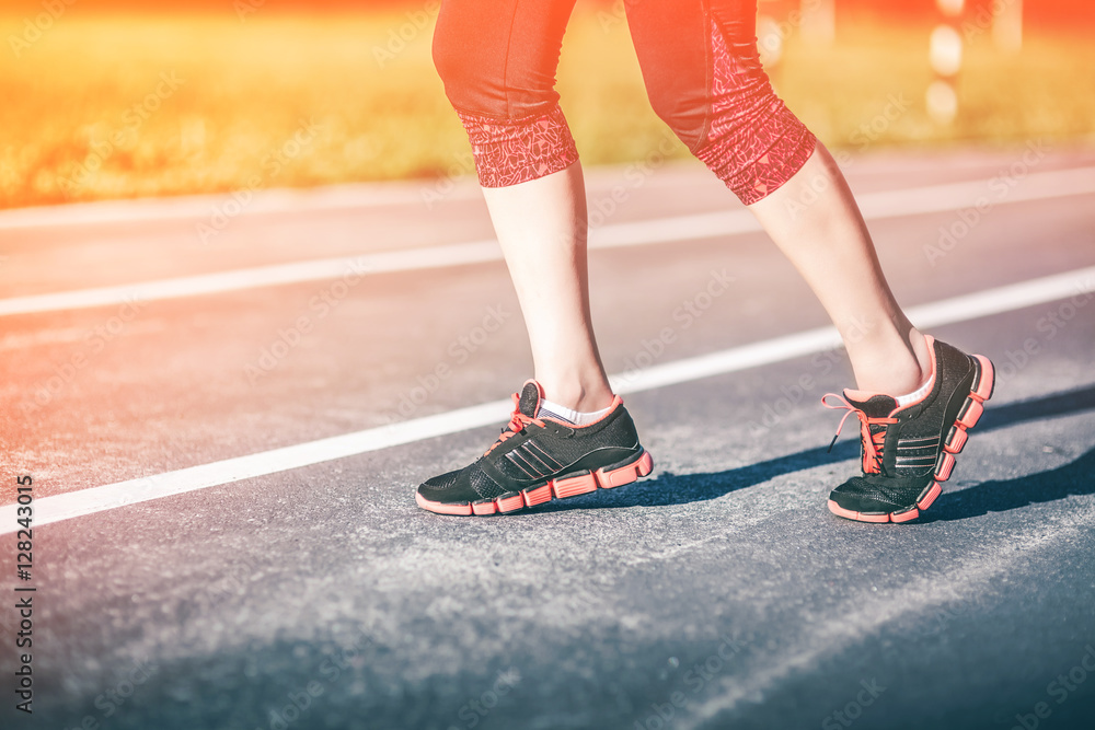 Fitness Girl Runner on track. Urban jogger Getting ready to start Stock ...