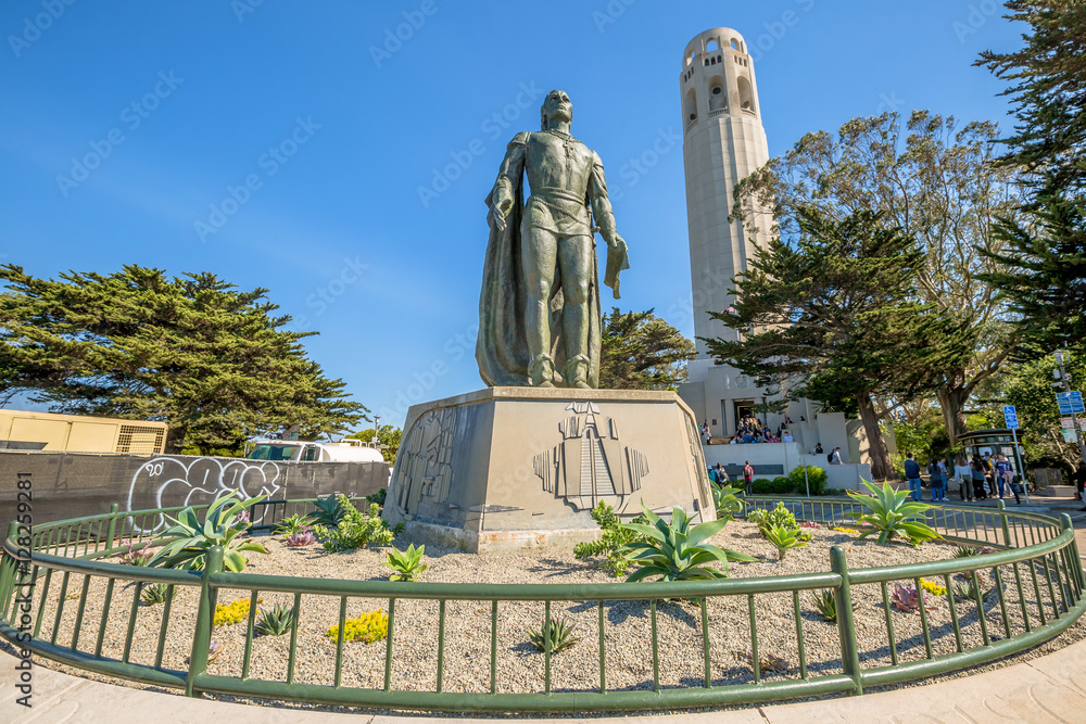 The statue of Christopher Columbus and Coit Tower. People lined up to ...