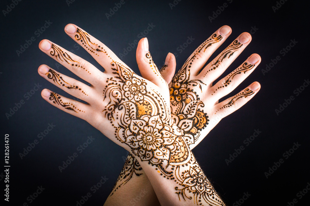 mehendi on hands on a black background Stock Photo | Adobe Stock