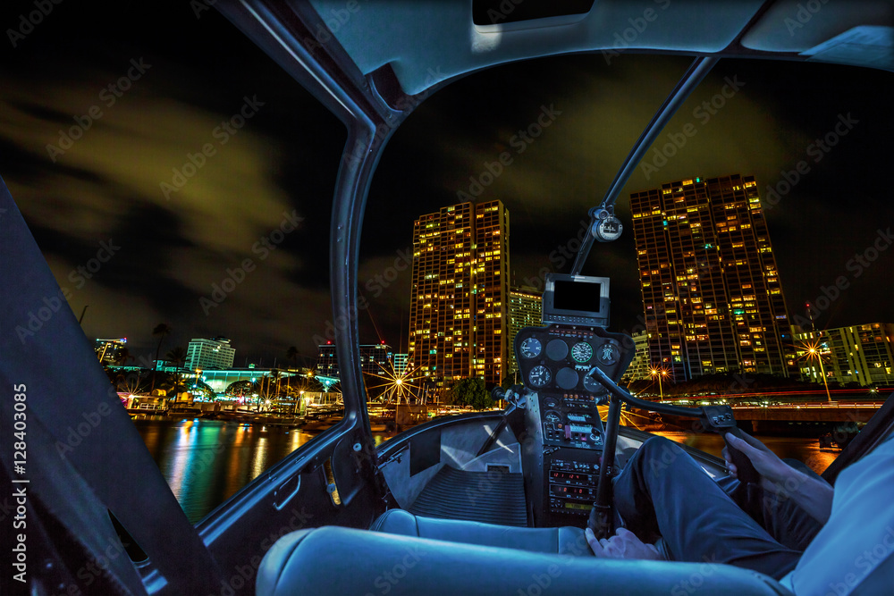 Helicopter cockpit flies in Honolulu skyline by night, Oahu, Hawaii ...