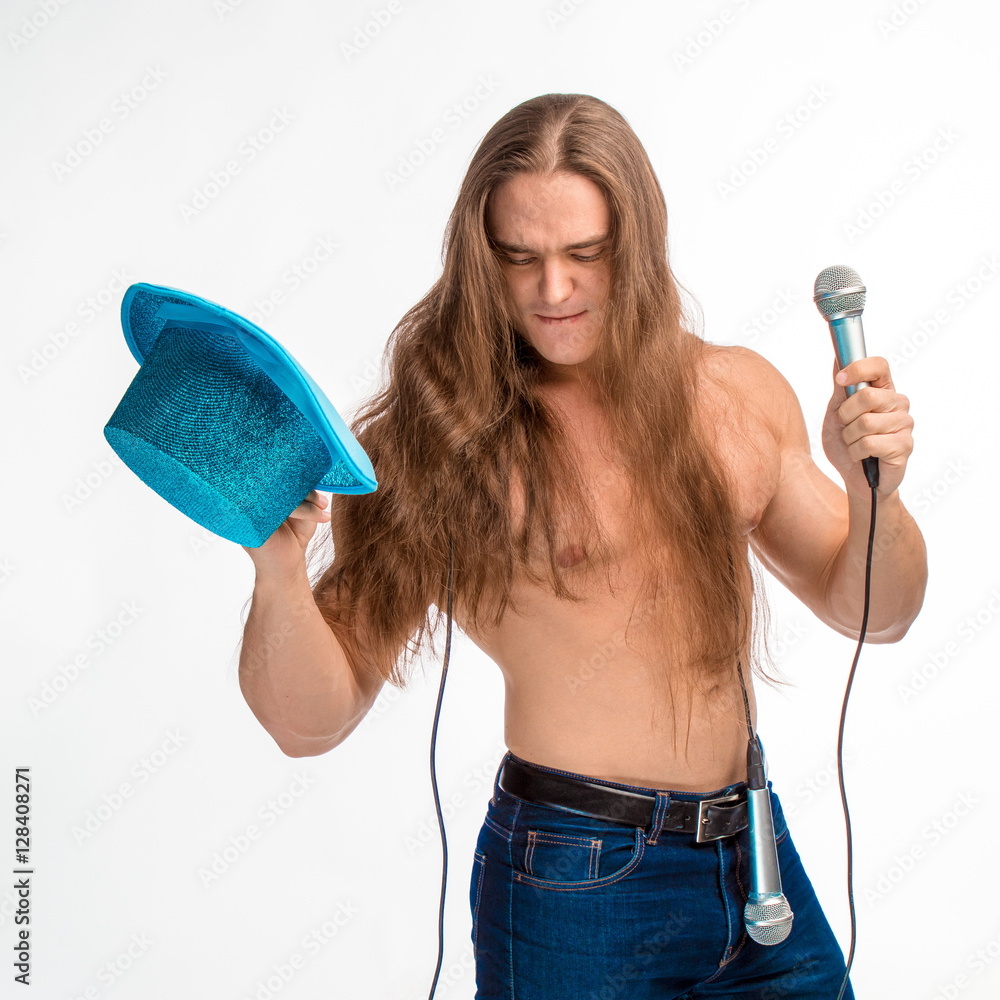 singer bodybuilder shirtless with long hair in a blue hat with a ...