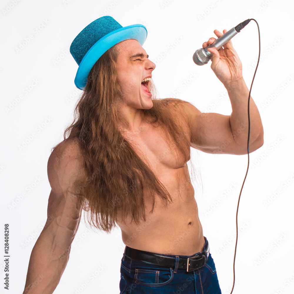 singer bodybuilder shirtless with long hair in a blue hat with a ...