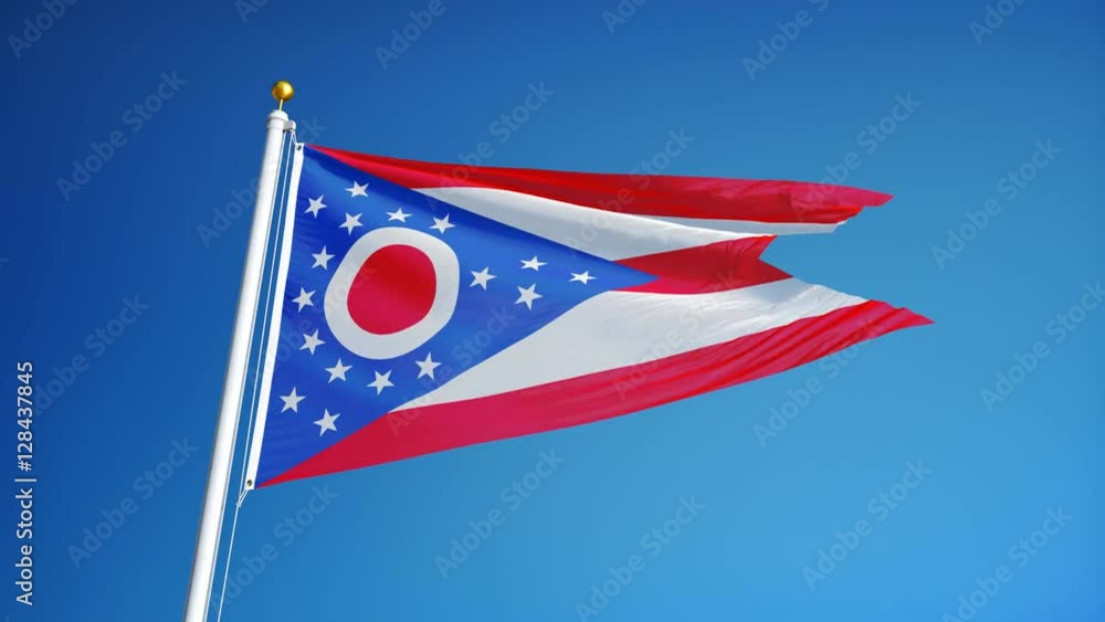 Ohio (U.S. state) flag waving in slow motion against blue sky ...
