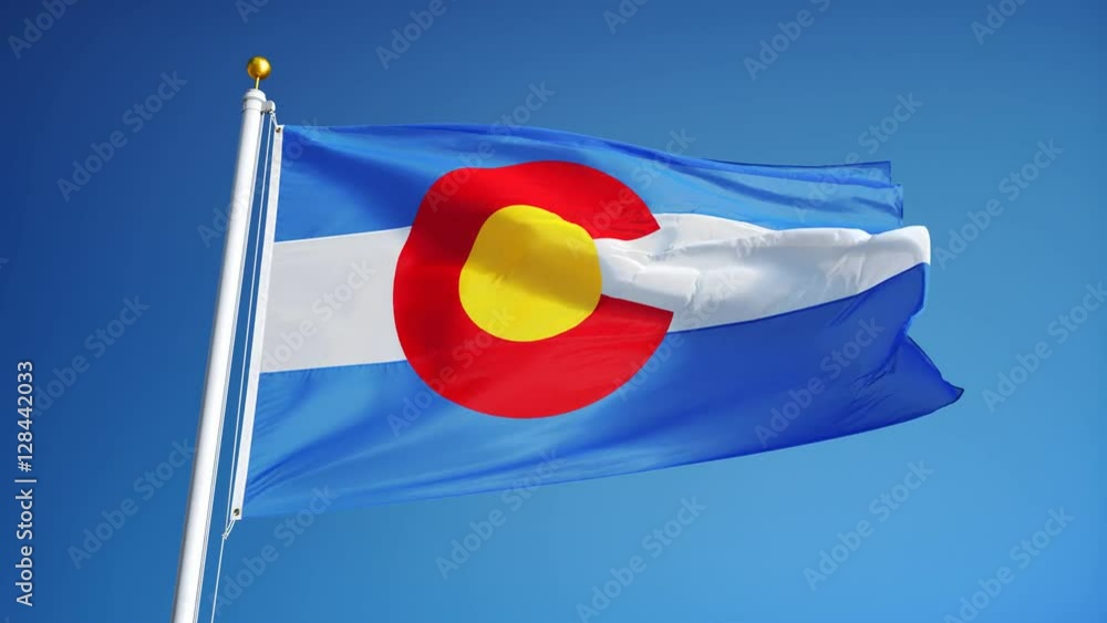 Colorado (U.S. state) flag waving in slow motion against blue sky ...