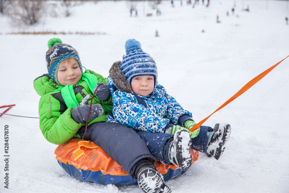 Sledding at winter time Stock Photo | Adobe Stock