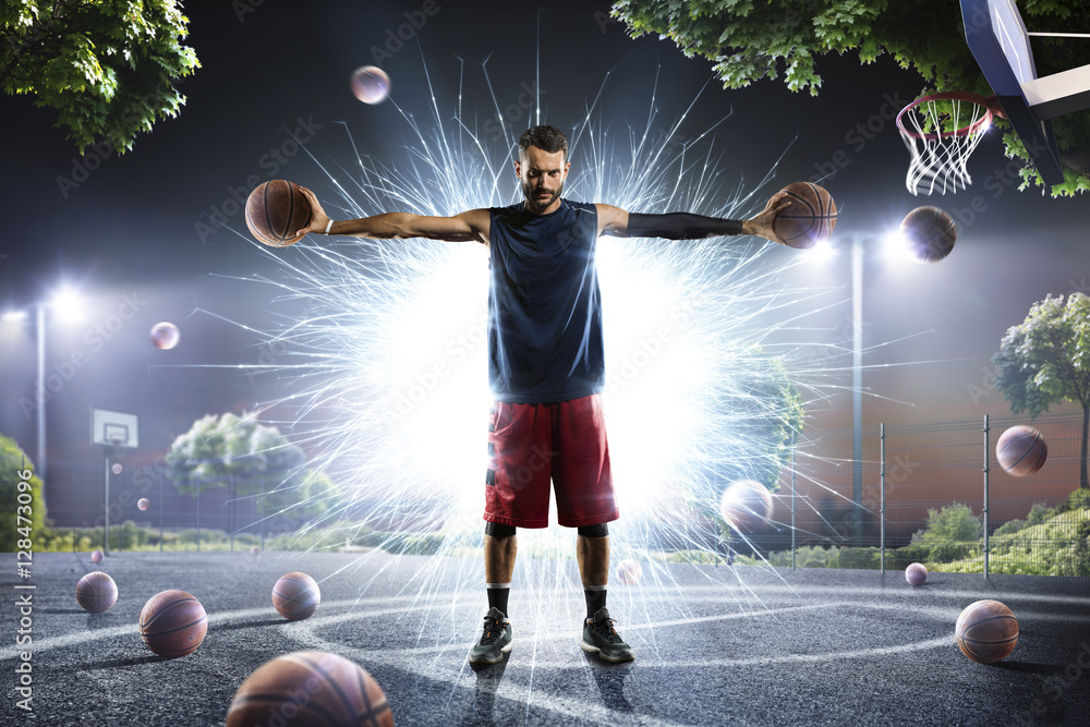 Basketball player is holding two balls in his hands Stock Photo | Adobe ...