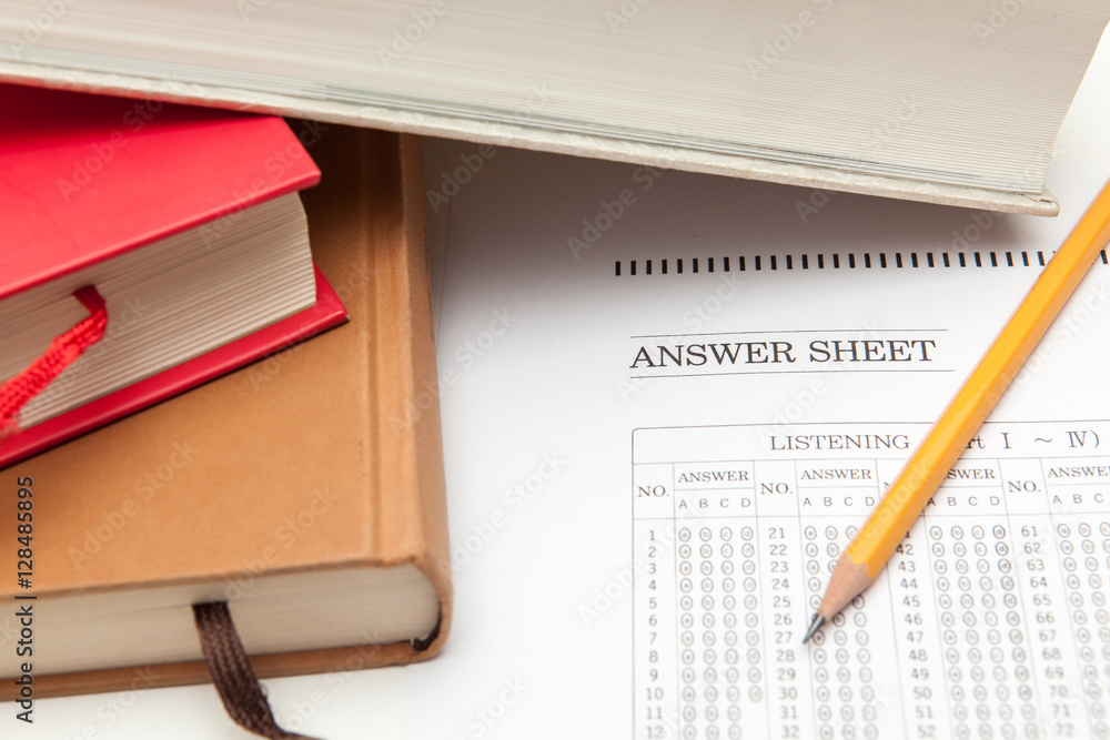 crumpled omr answer sheet and books on white backgrounds Stock Photo ...