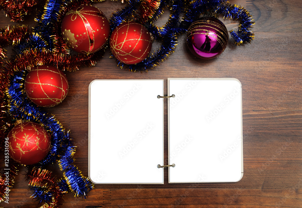 Opened blank notepad on a table with a Christmas decoration Stock Photo ...