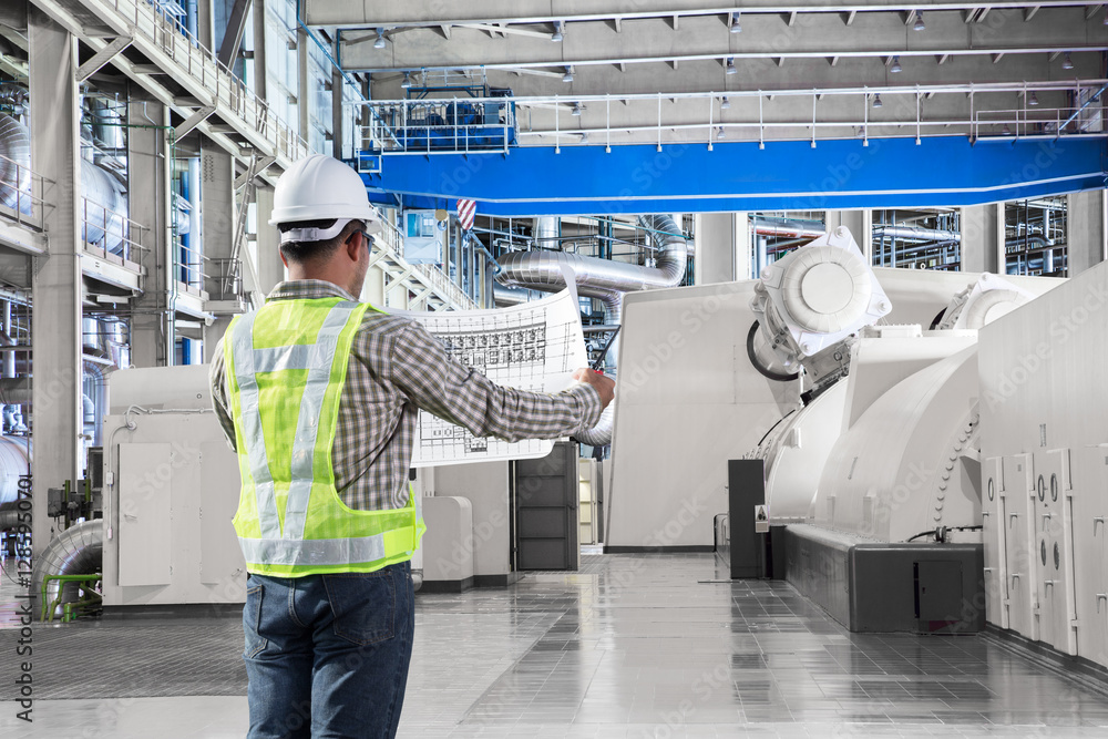 Engineer reading drawing diagram for maintance at powerhouse Stock ...