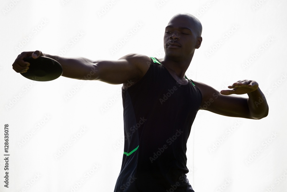 Athlete about to throw a discus Stock Photo | Adobe Stock