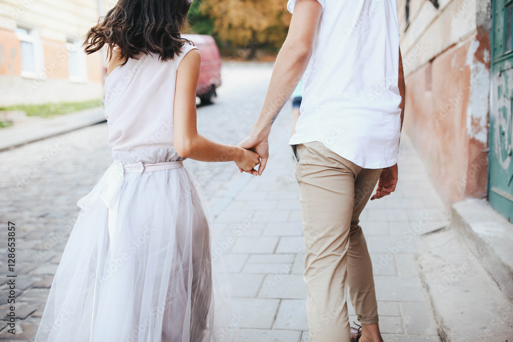 beautiful and young boy and girl walking down the street Stock Photo ...