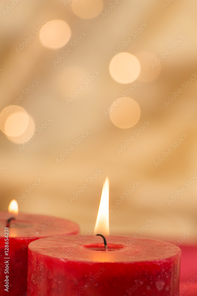 Lit red candles closeup and golden background with bokeh. Stock Photo ...