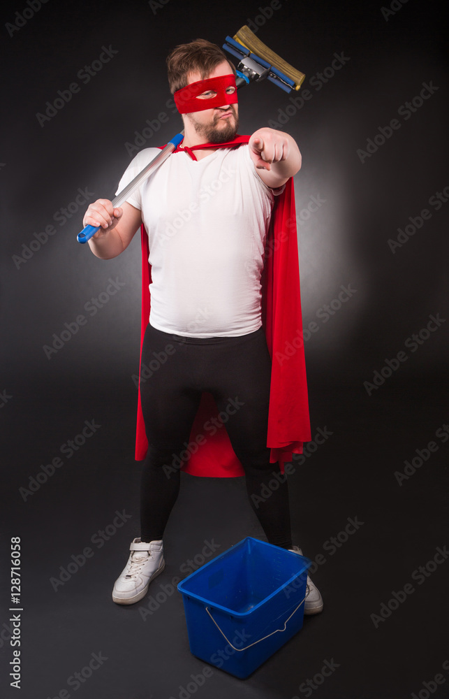 Cleaning concept. Super hero man ready to help your office or house ...