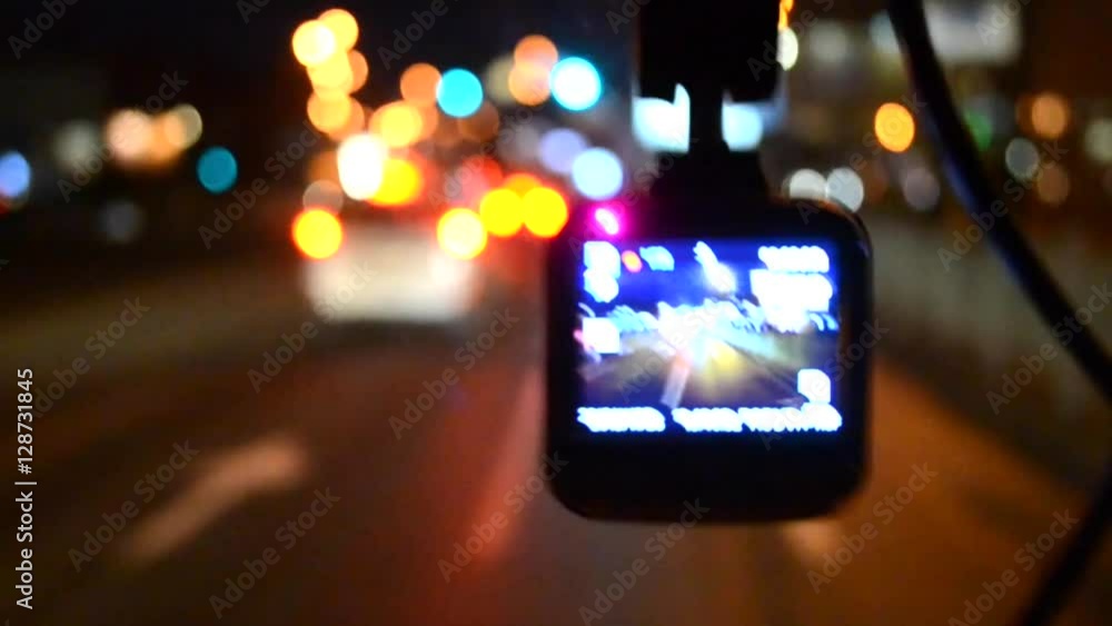 video recorder in the car on the night city road closeup. The actual ...