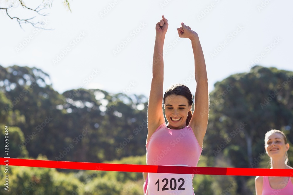 Cheerful winner athlete crossing finish line Stock Photo | Adobe Stock