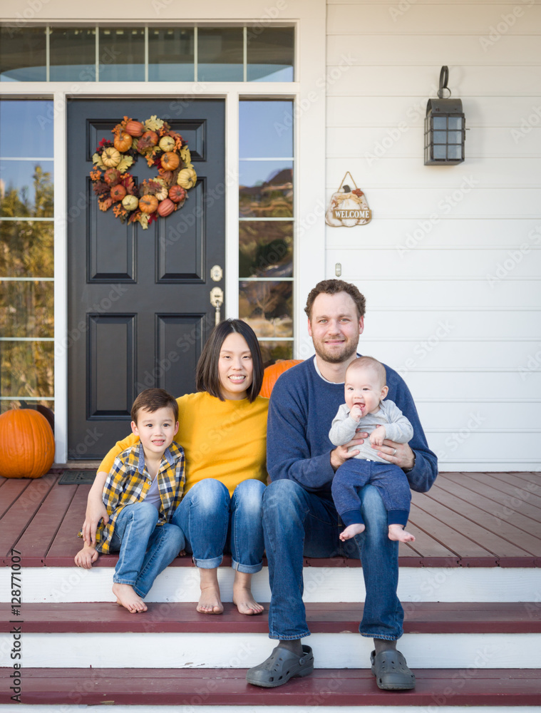 Young Mixed Race Chinese and Caucasian Family Portrait On Their Front ...