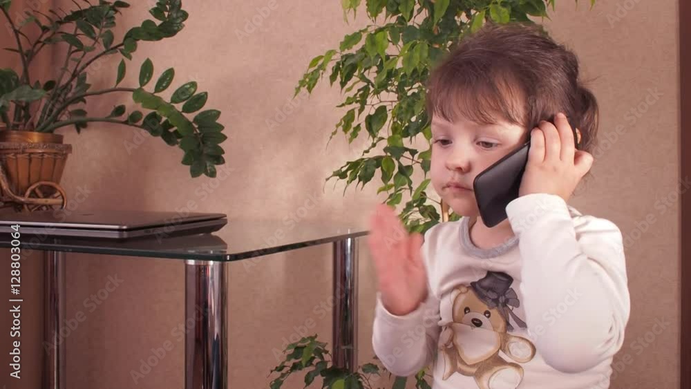 A child talking on a cell phone Stock Video | Adobe Stock