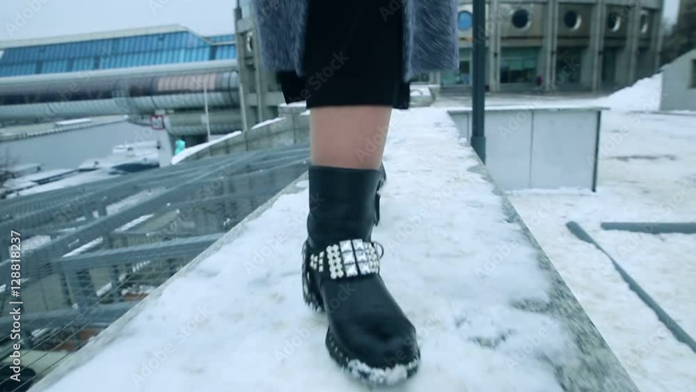 Girl dancing in boots in the snow Stock Video | Adobe Stock