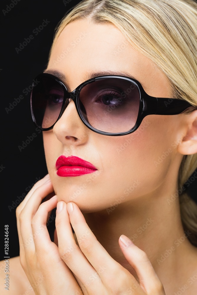 Portrait of woman posing for the camera Stock Photo | Adobe Stock