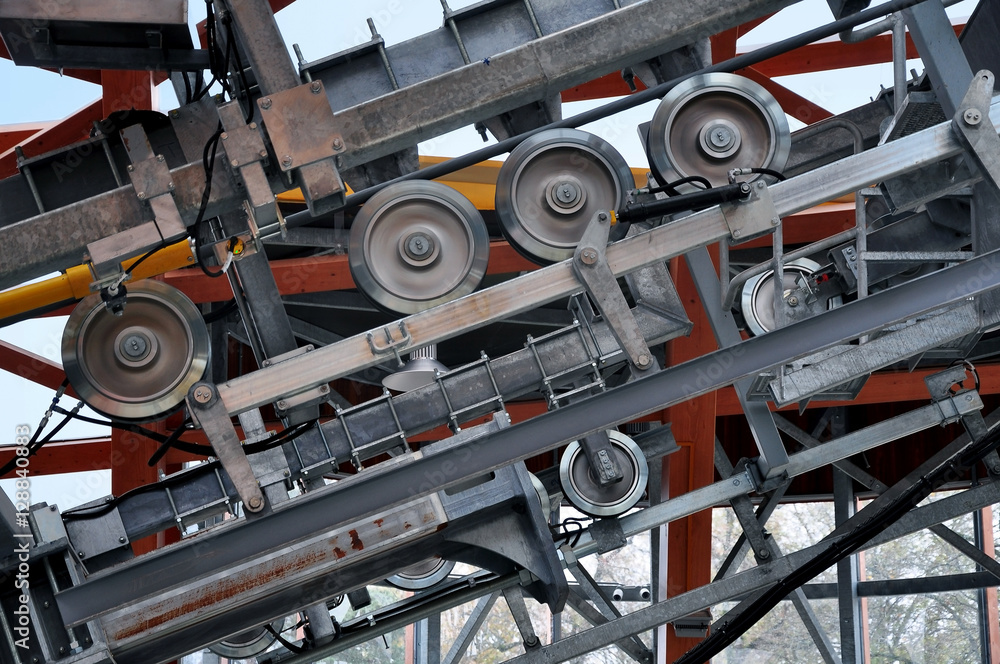 Details of the driving mechanism of cable car. Metal wheels and frame ...