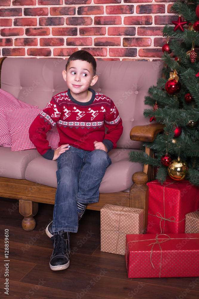 One Boy sitting on chair and smiling Stock Photo | Adobe Stock