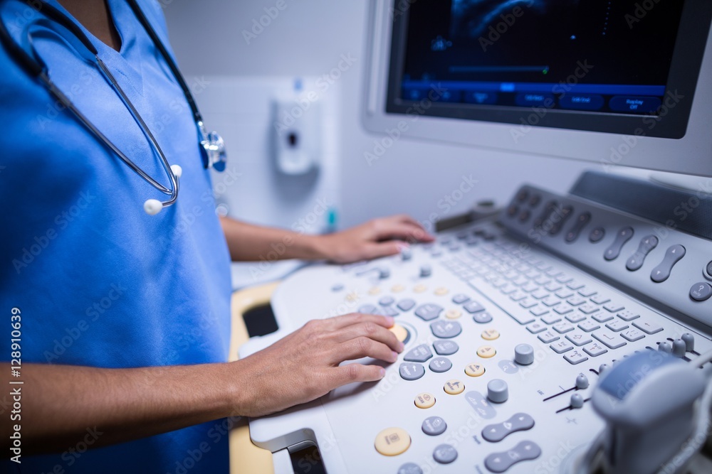 Nurse using ultrasonic device Stock Photo | Adobe Stock