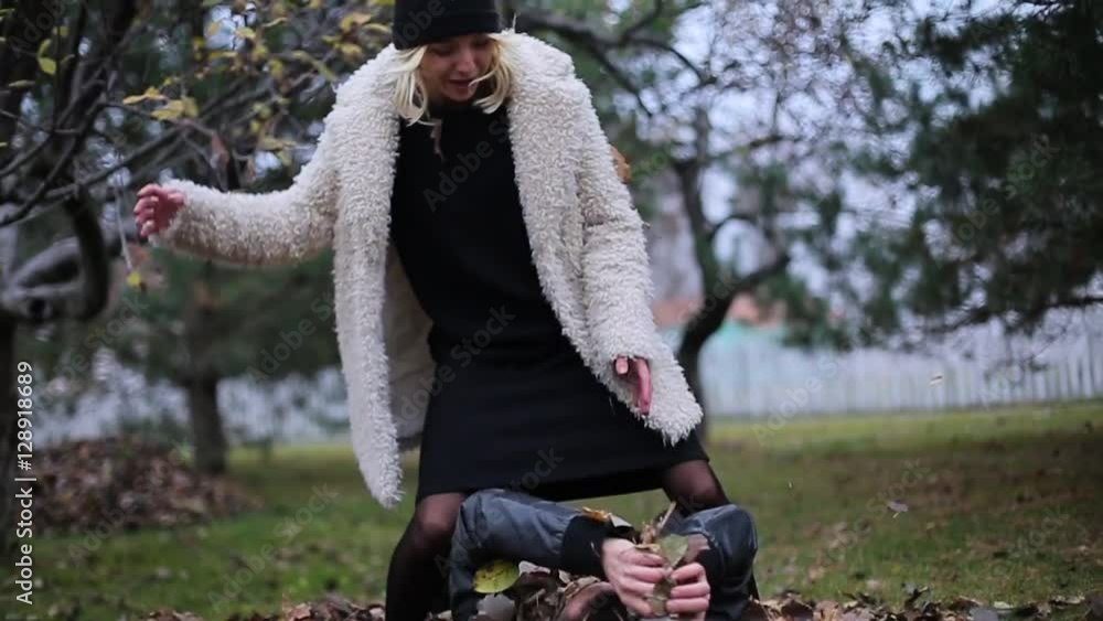 couple throwing leaves at each other. Stock Video | Adobe Stock