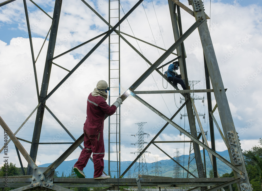 Welder work at high Electric high voltage pole 230 Kv Stock Photo ...