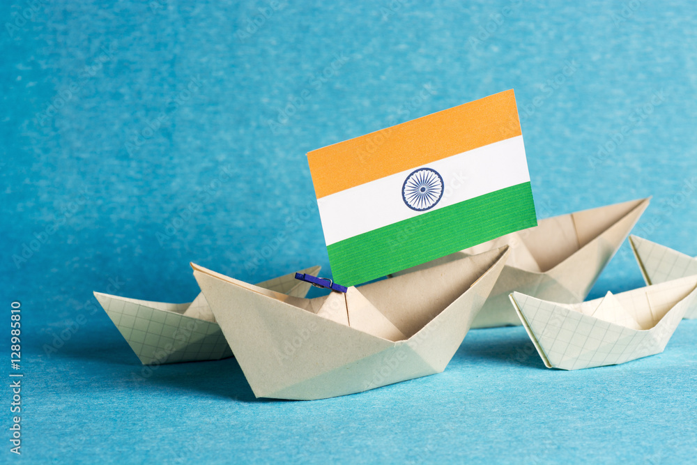 paper ship with Flags of India. blue green sea water ocean background ...