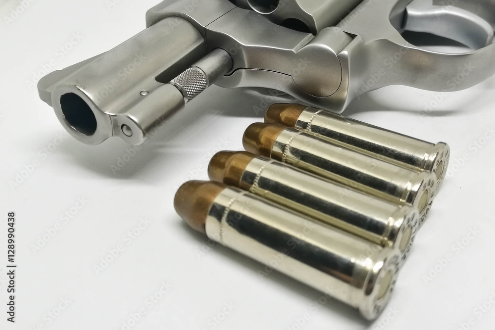 Bullet close-up on 38 Super ammo with a handgun isolated on white ...