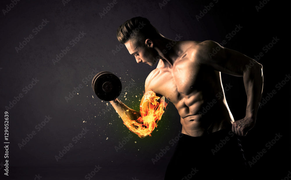 Bodybuilder athlete lifting weight with fire explode arm concept Stock ...