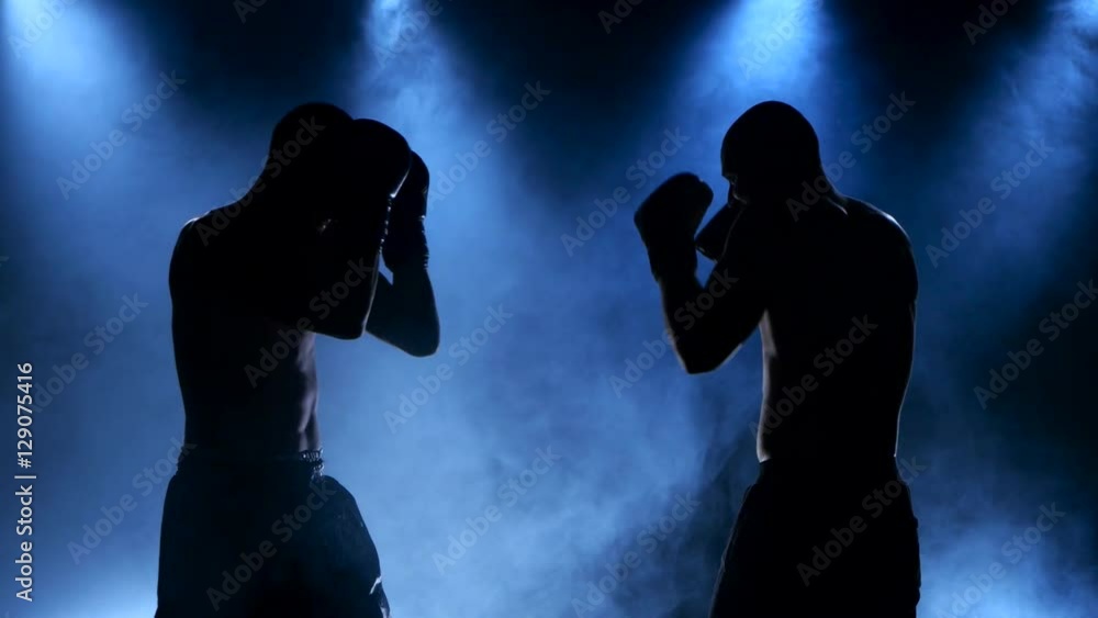 Boxing two young sportsman in a smoky studio in silhouette Stock Video ...