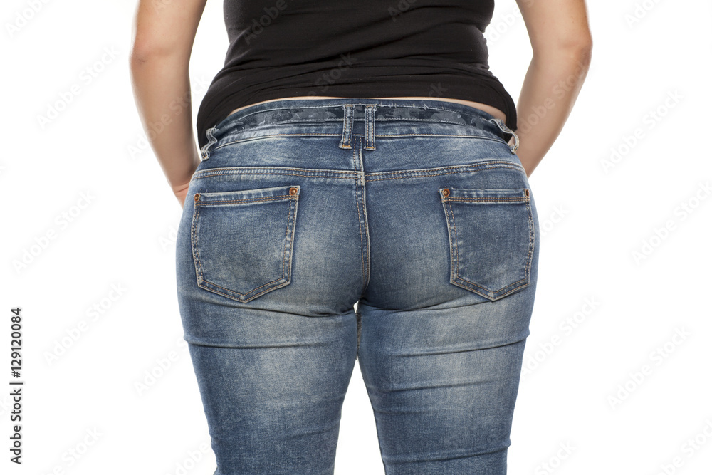 rear view of a fat woman in jeans on white background Stock Photo ...