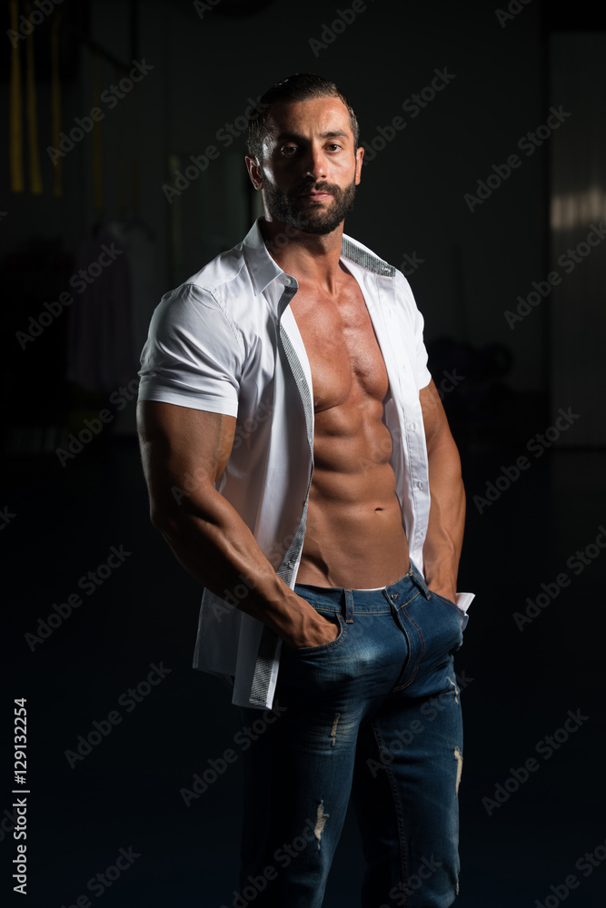 Foto De Sexy Latin Man Posing In White Shirt Do Stock Adobe Stock