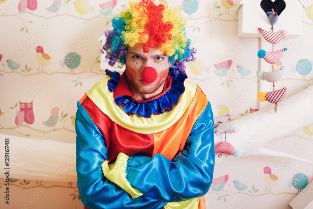Angry clown with rainbow colored hairstyle. Stock Photo | Adobe Stock