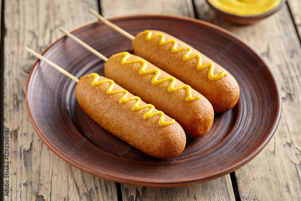 Corn dog street junk food fried hotdog meat sausage snack with mustard ...