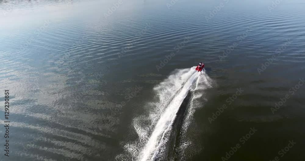 Water motorcycle floats on the wide river. Reflection of sky Stock ...