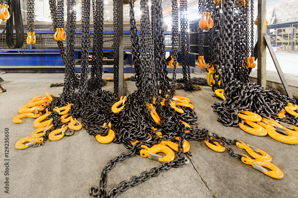 Rack with new cargo chain slings. Stock Photo | Adobe Stock
